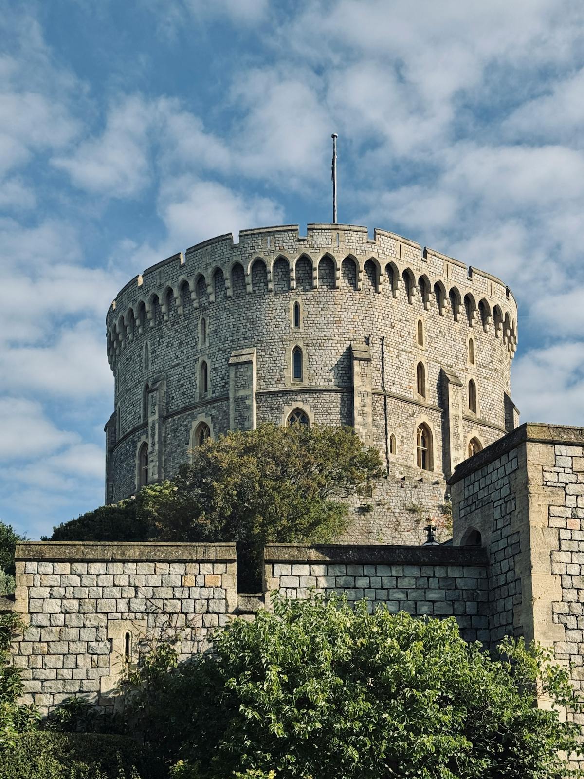 The Round Tower at Windsor Castle framed by lush greenery
