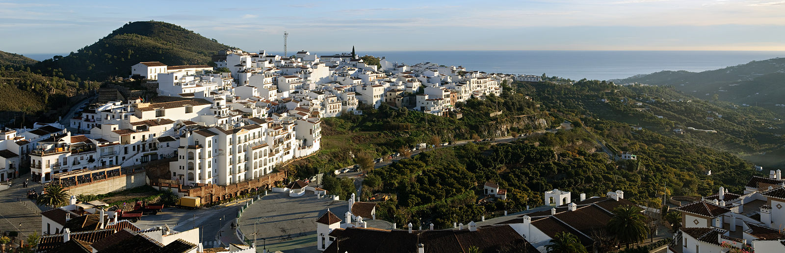Panoramic view of Frigiliana white village on hillside in Andalusia